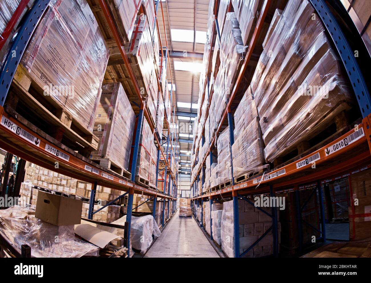 aisle at warehouse in London Stock Photo - Alamy