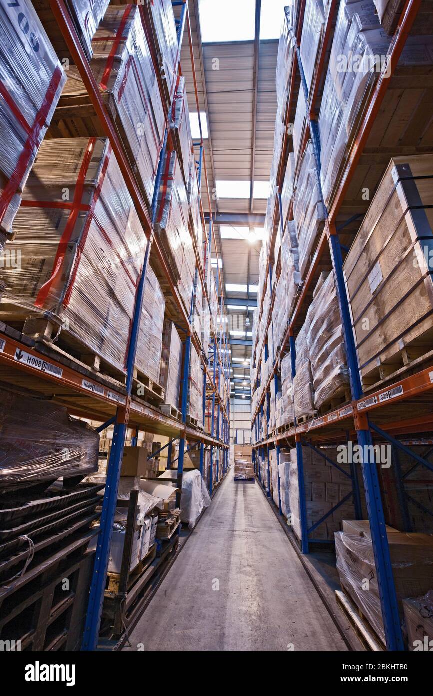 aisle at warehouse in London Stock Photo - Alamy