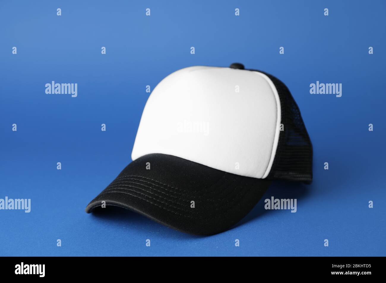 Blank cap on color background Stock Photo - Alamy