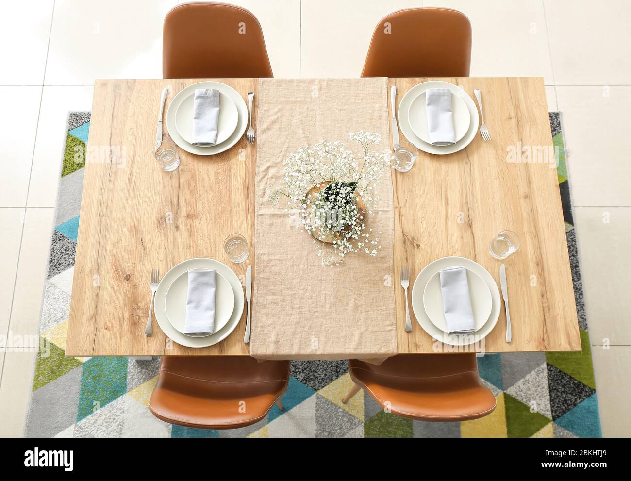 Served table in modern dining room, top view Stock Photo - Alamy
