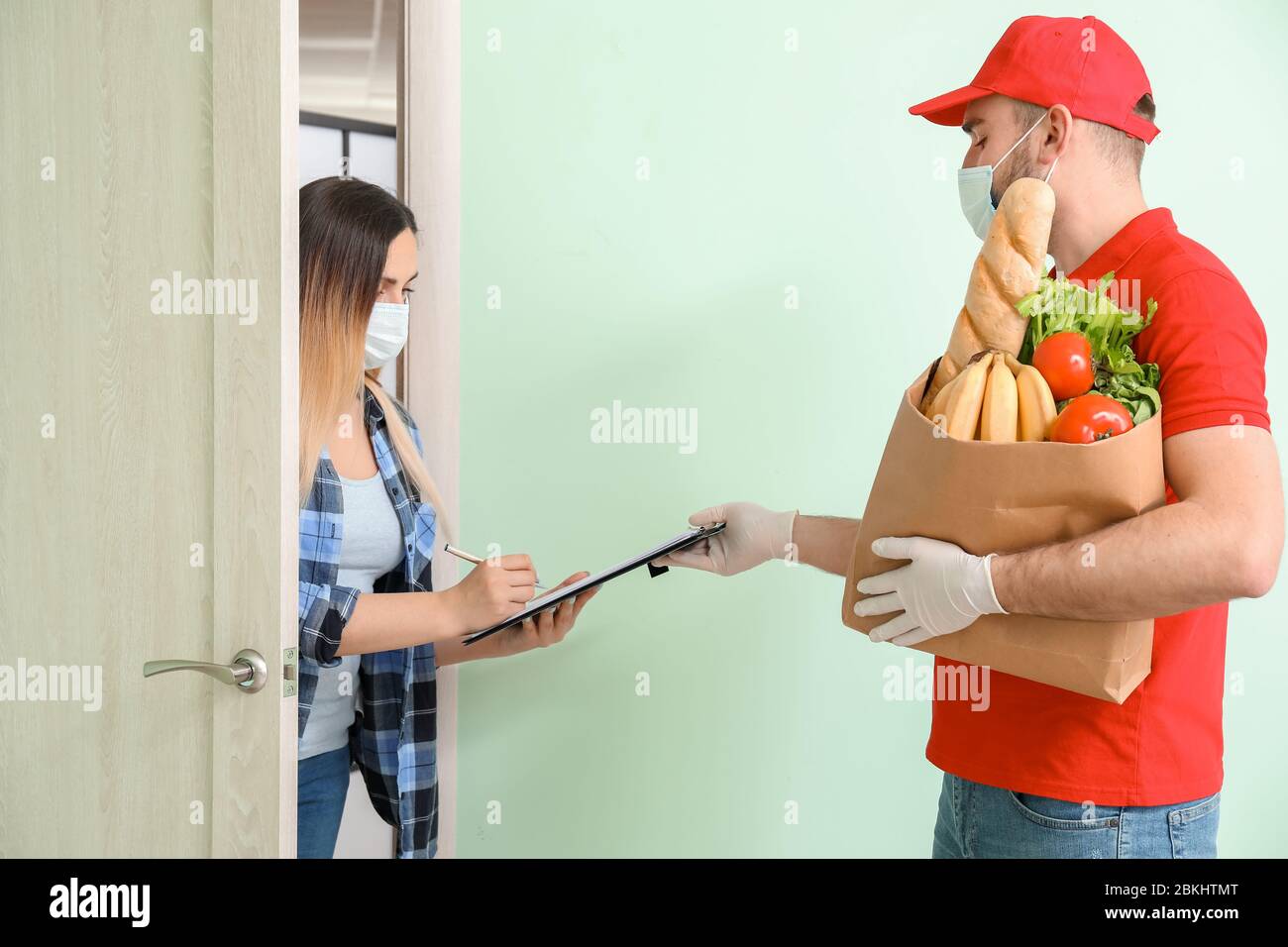 Female signing documents receiving hi-res stock photography and images ...