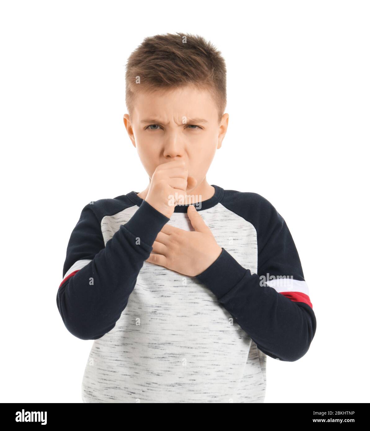 Ill coughing little boy on white background Stock Photo - Alamy