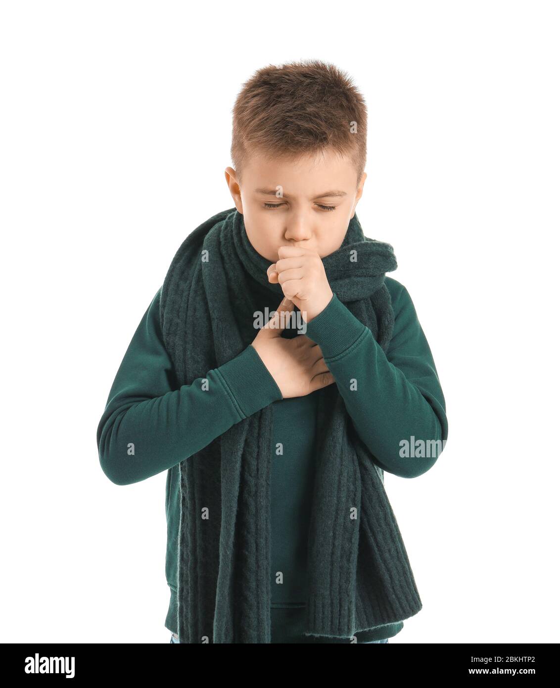 Ill coughing little boy on white background Stock Photo - Alamy