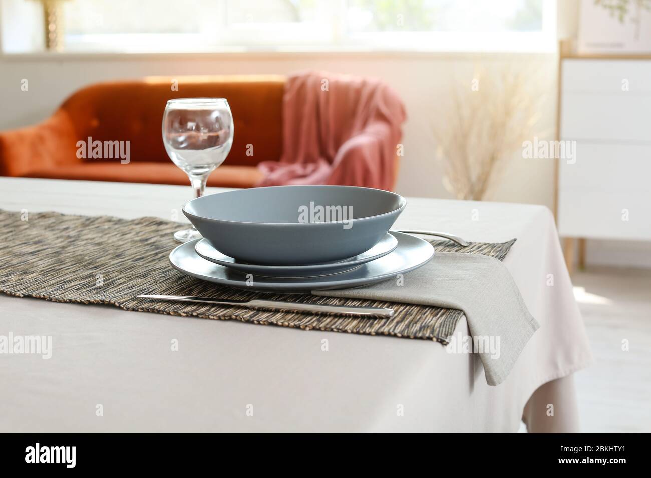 Table served in dining room Stock Photo - Alamy