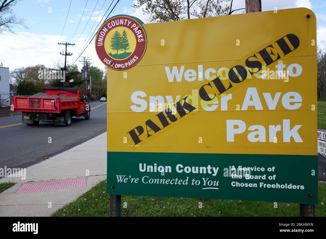 "Park closed" warning sign place over the sign board of Snyder Ave Park ...