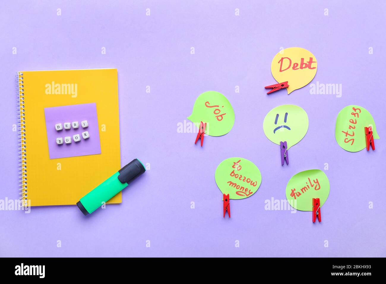 Debt book with stickers on color background Stock Photo - Alamy