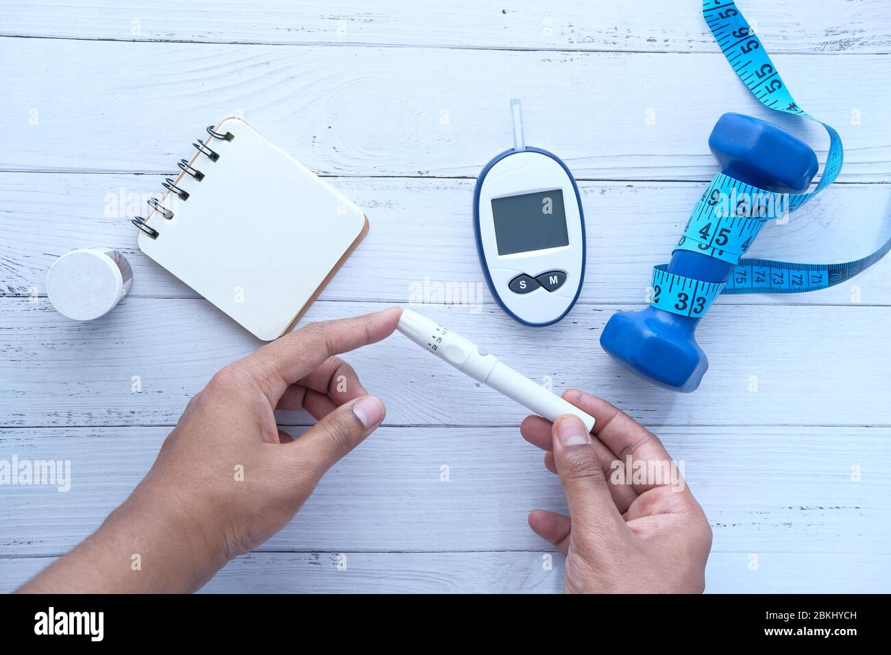 Checking blood glucose finger hi-res stock photography and images - Alamy