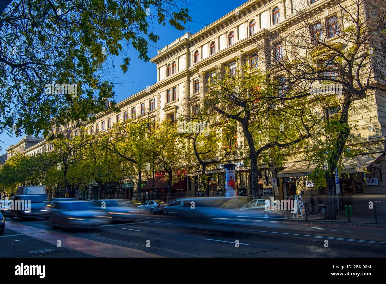 Downtown Budapest (Pest)- Andrassy Ut boulevard with trees reflecting ...