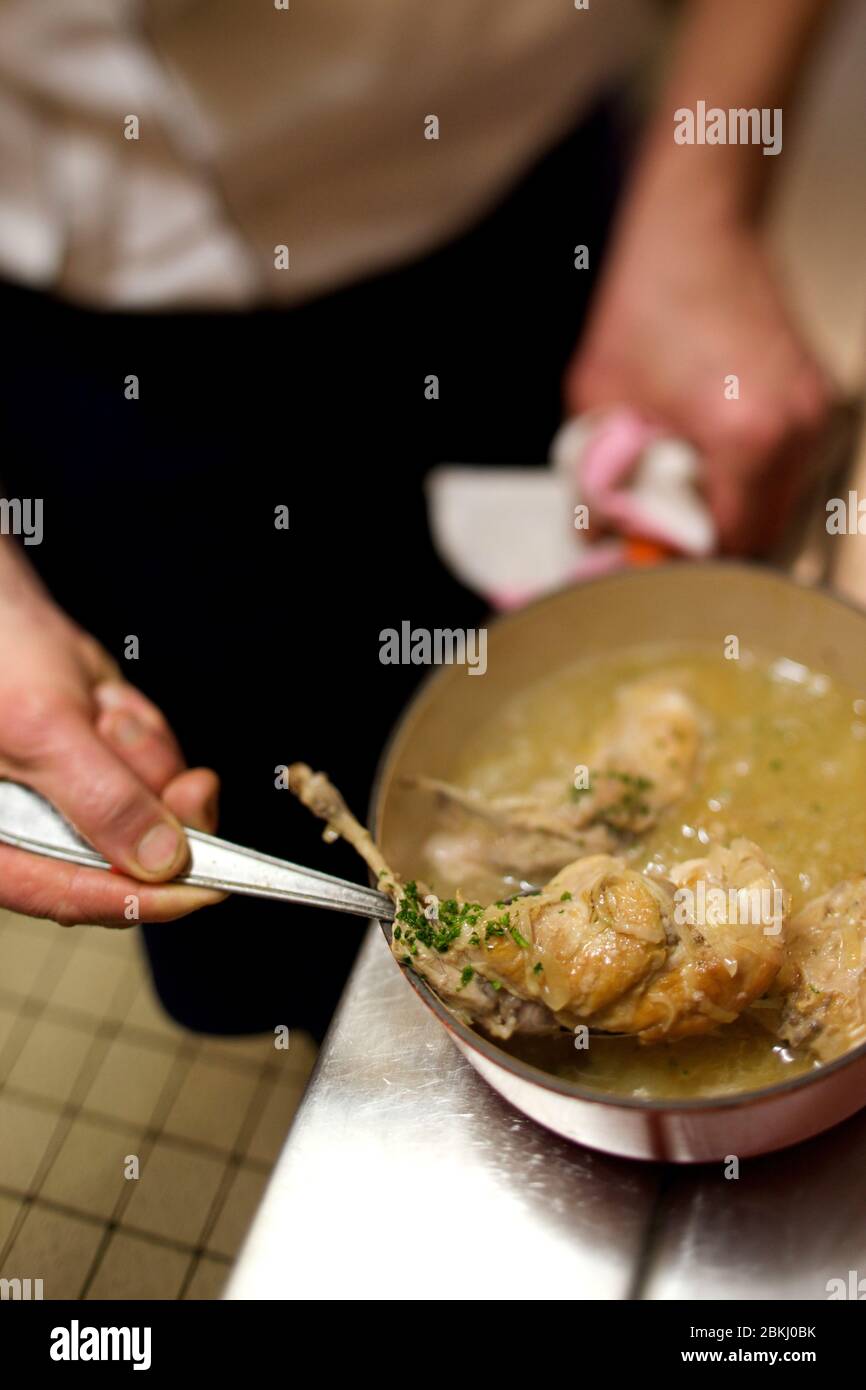 France, Paris, Quincy bistro, preparation of rabbit with shallots Stock ...