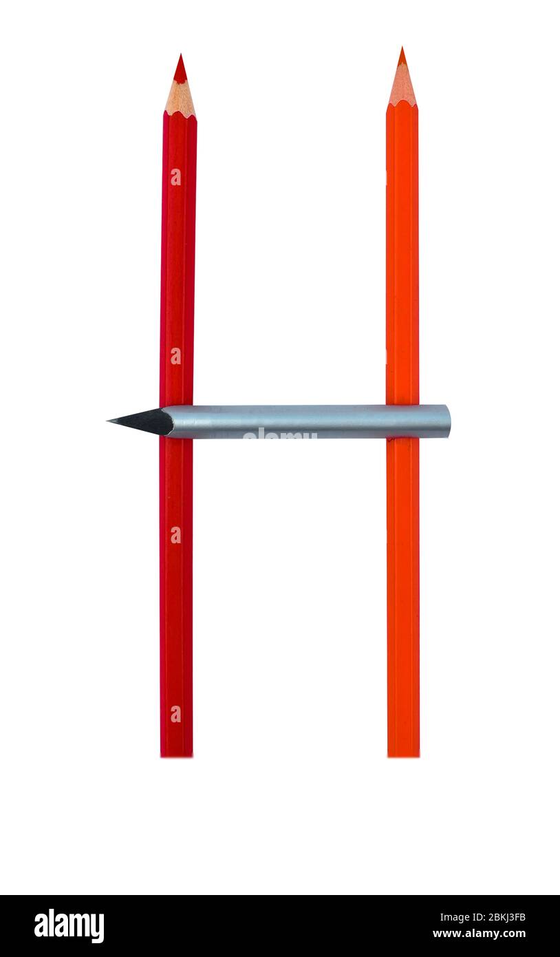 Three wood pencil crayons arranged as a h shaped pattern on a white ...