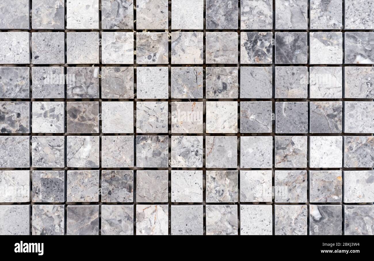 Ceramic mosaic tiles with gray and white embossed squares to decorate ...