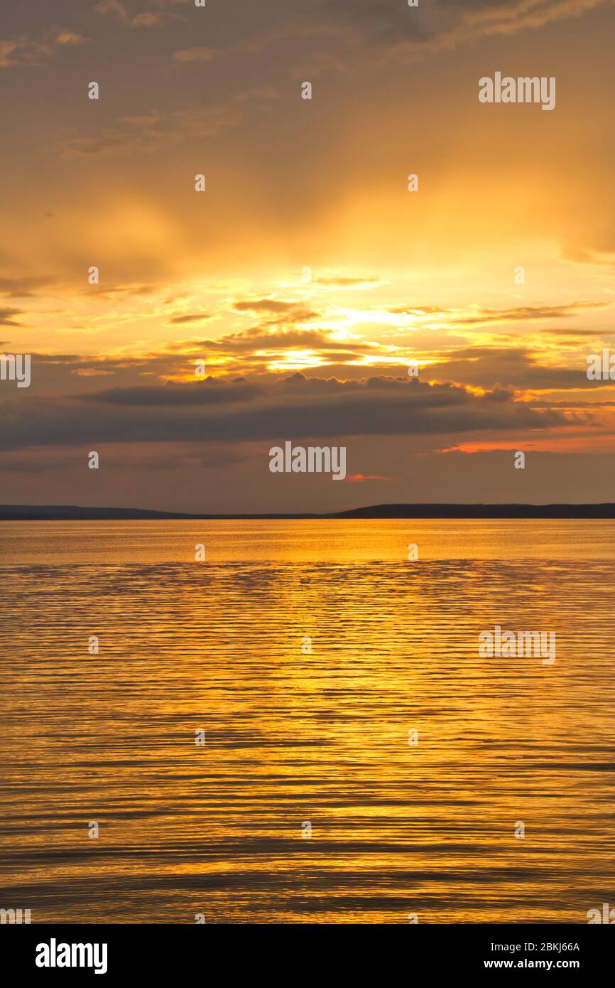 Golden Sunlight over a Lake Stock Photo - Alamy