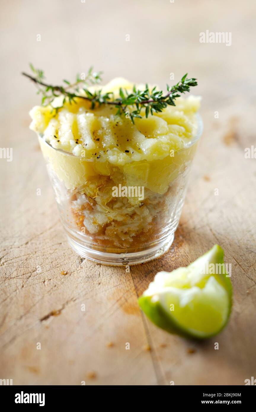 Lemon breaded fish parmentier Stock Photo - Alamy
