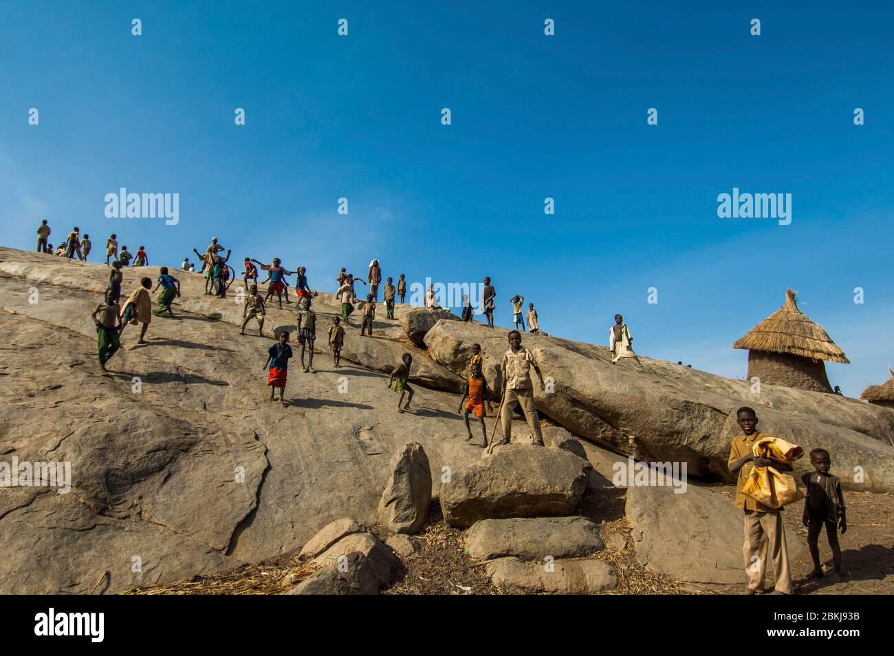 Sudan, south Kordofan, Nuba Hills, Nyaro, children playing on rocky ...
