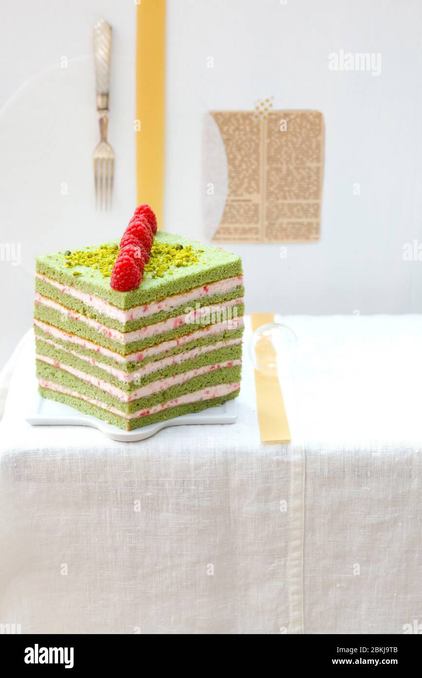 Cubism cake pistachio raspberry cube Stock Photo - Alamy