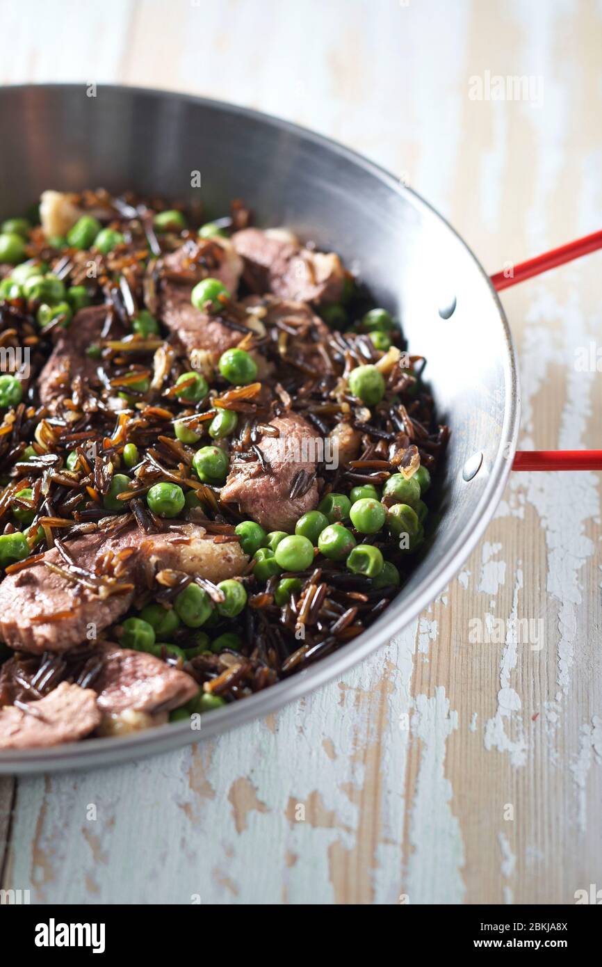 Duck wild rice paella Stock Photo - Alamy