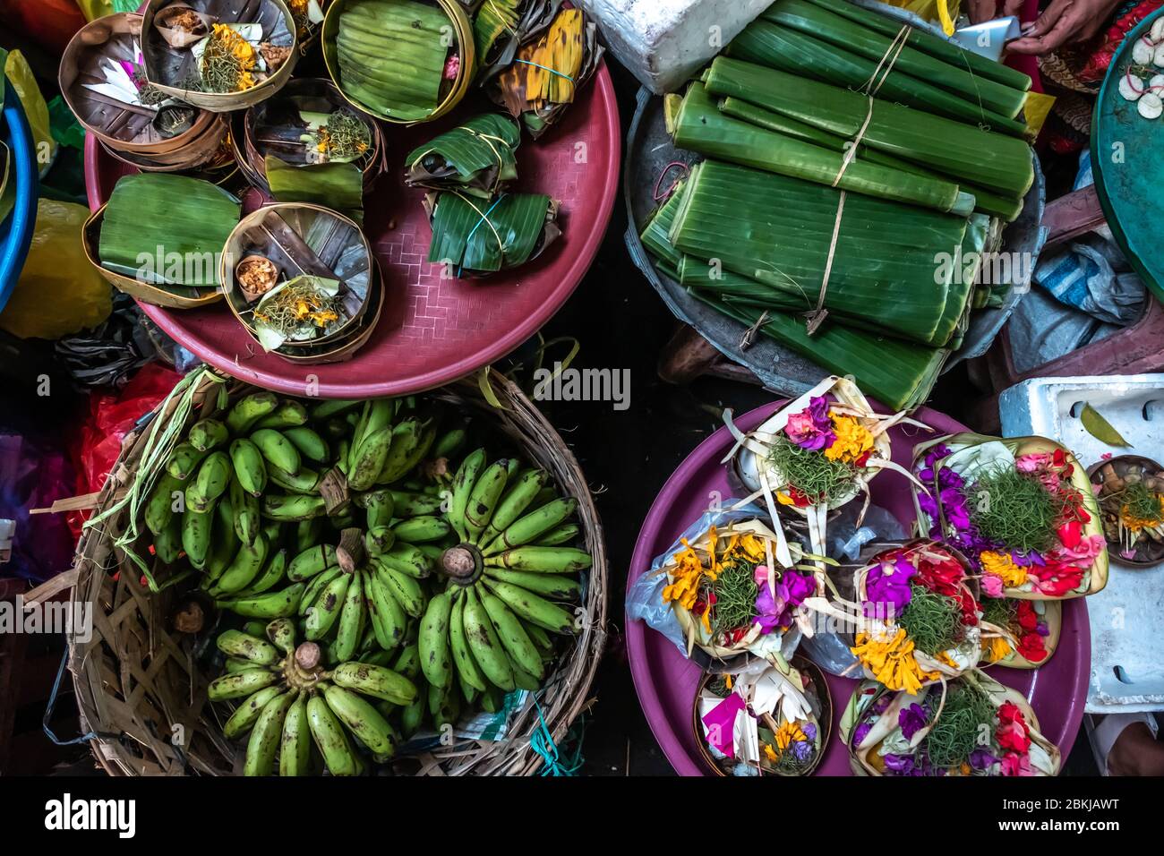 Bali island style incense, green bananas and flower basket in Ubud ...