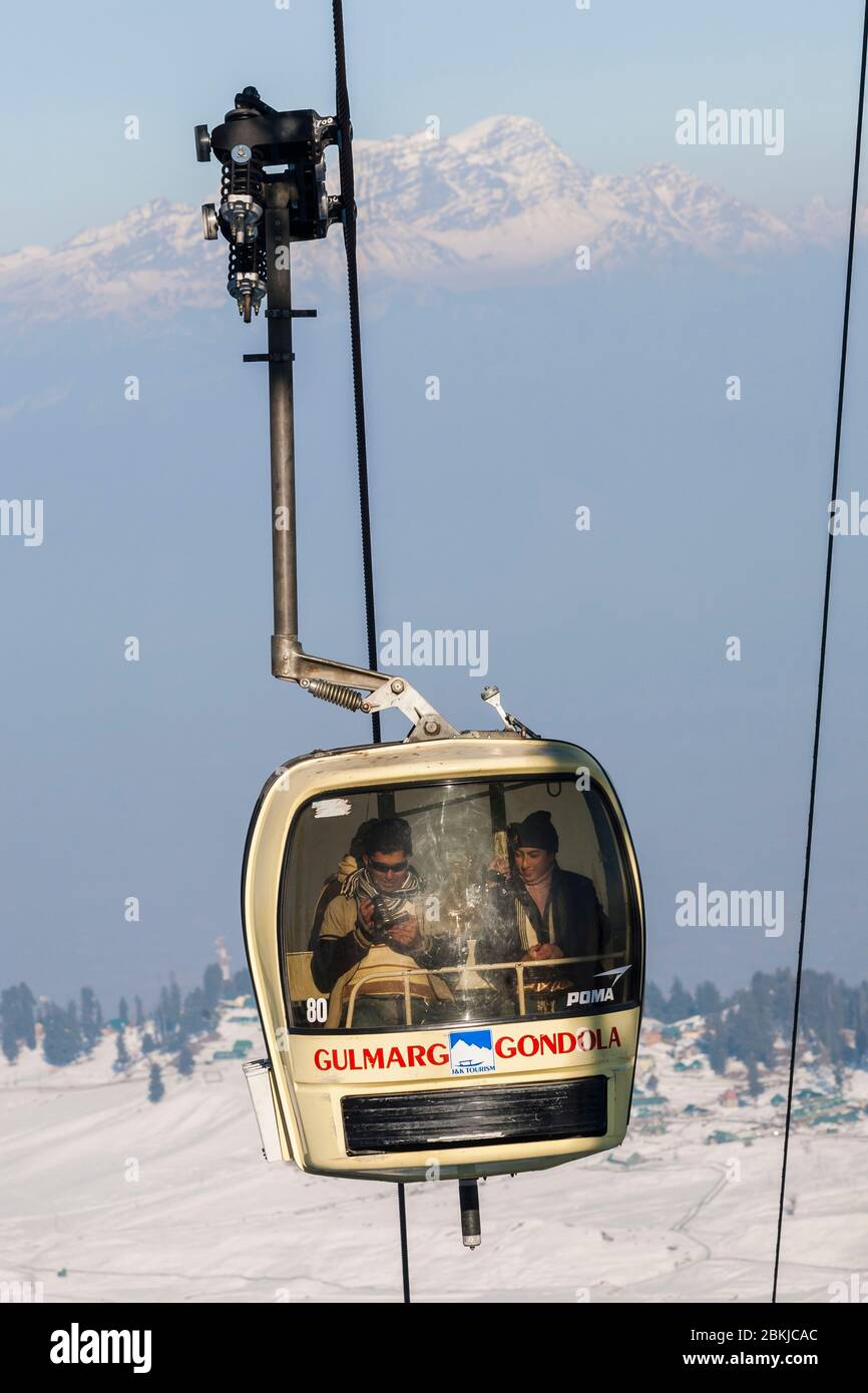 India, Jammu and Kashmir, Gulmarg, indian tourists couple in Gondola cable car and Mount Harmukh ...