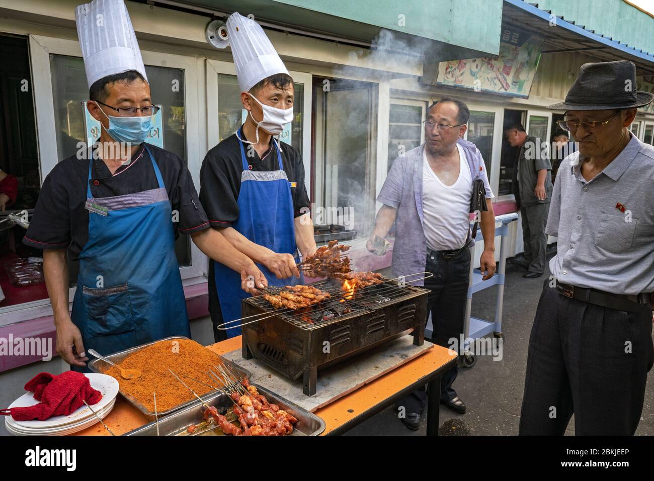 North Korea, Pyongyang, food and beer stall in front of the Kwangbok ...
