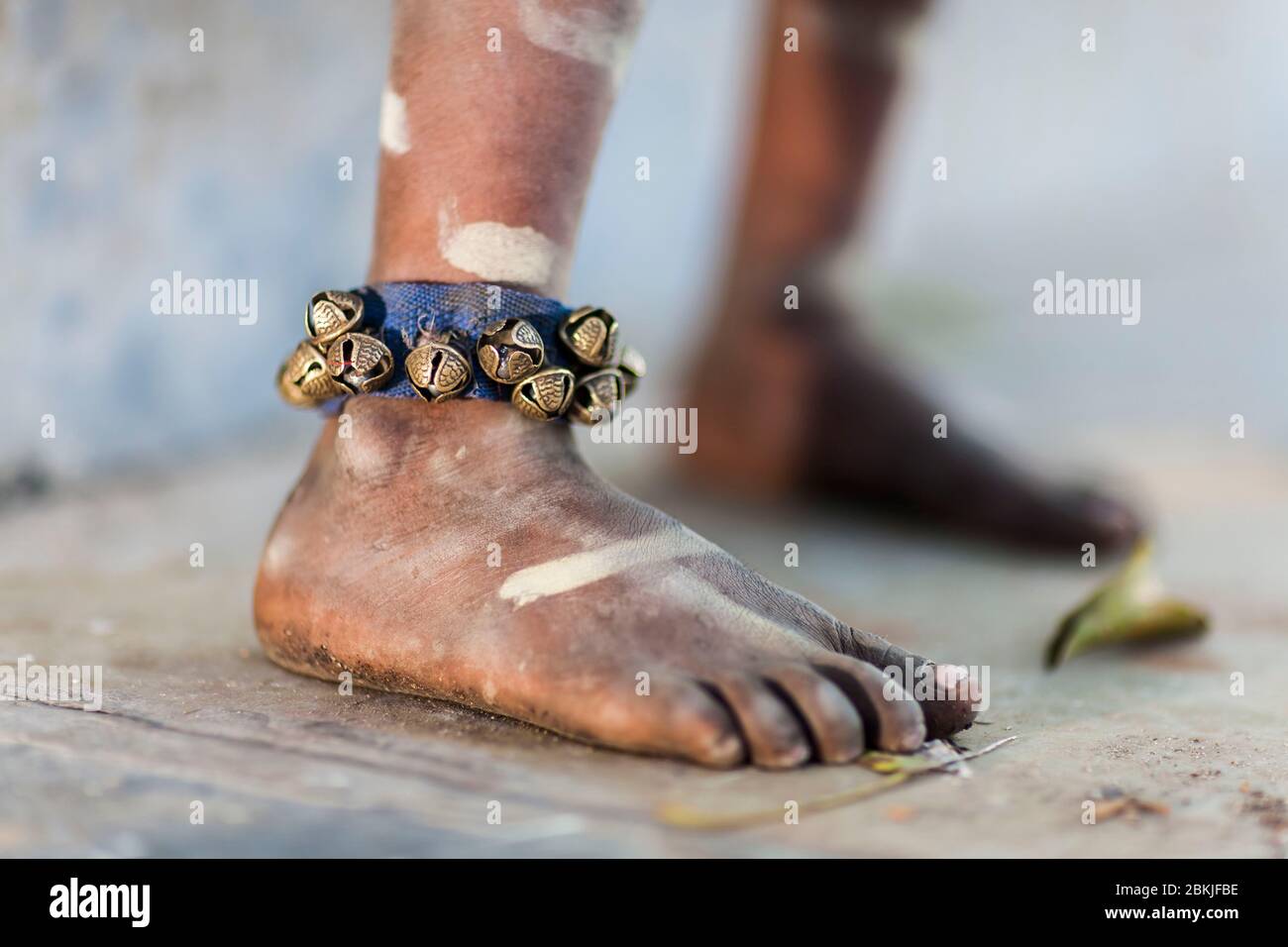 India, Rajasthan, Udaipur, detail of a child's foot wearing bells ...