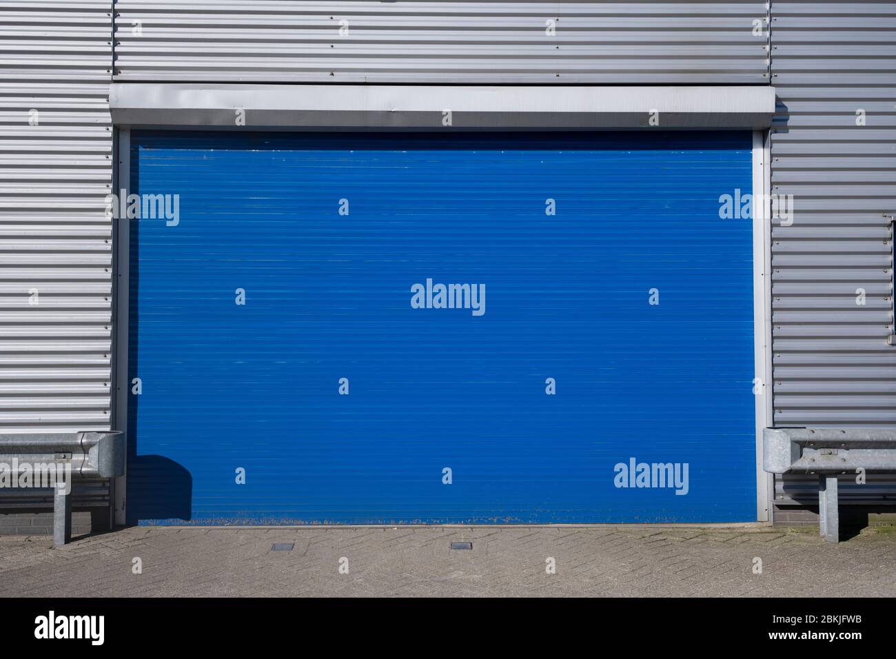 Roller shutter door and concrete floor outside factory building for ...