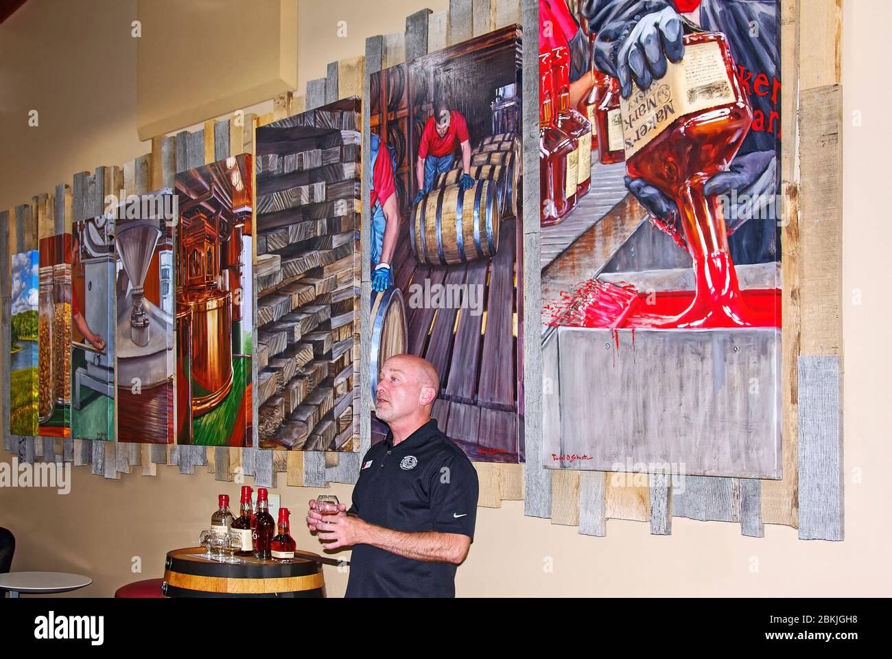 man explaining bourbon making process, employee job, large wall ...