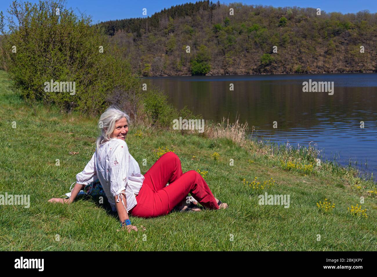 Europe, Luxembourg, Insenborn, Attractive Older Woman sitting on the ...