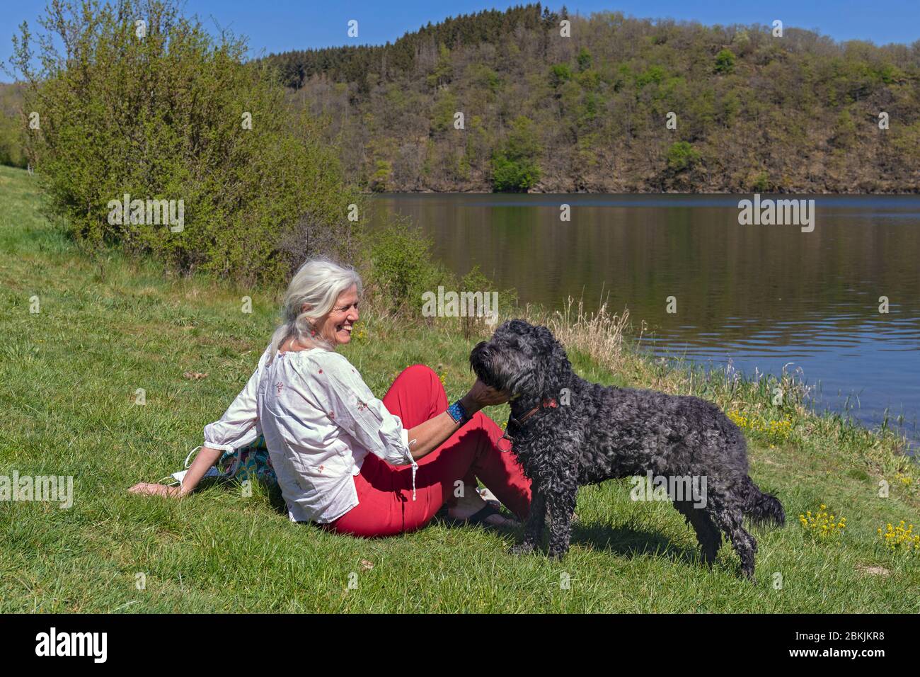 Europe, Luxembourg, Insenborn, Attractive Older Woman sitting on the ...
