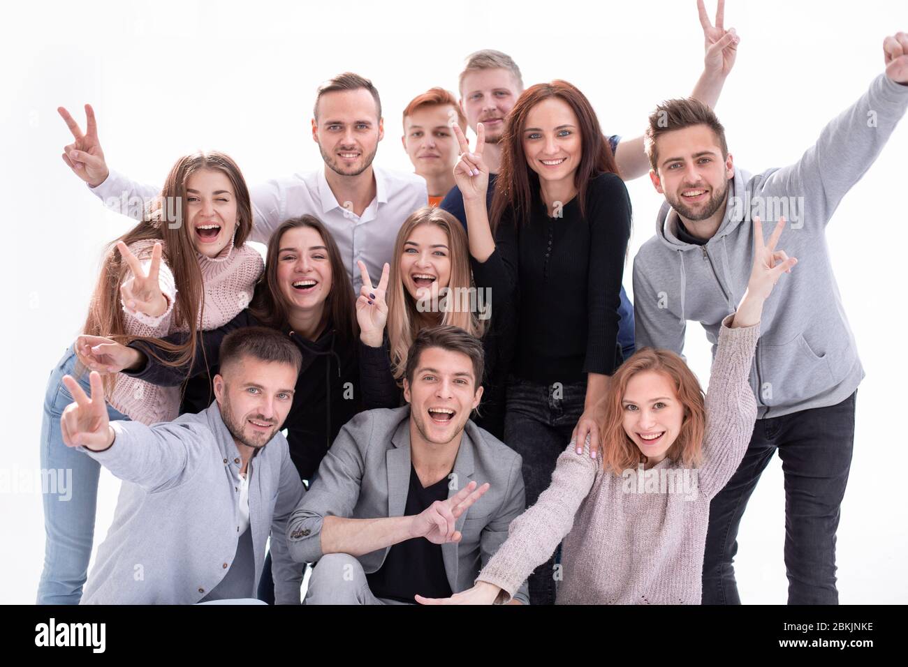 large group of cheerful friends looking at the camera Stock Photo - Alamy