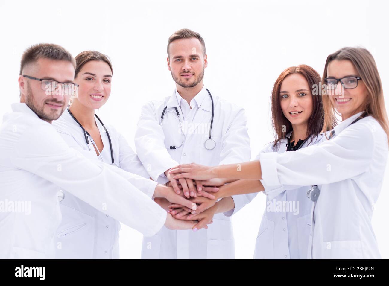 group of young doctors putting their palms together Stock Photo - Alamy
