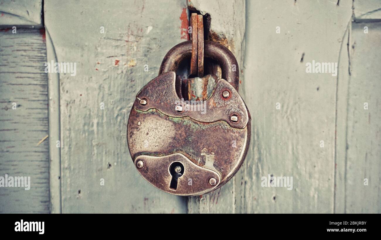 The door has a vintage old lock Stock Photo - Alamy