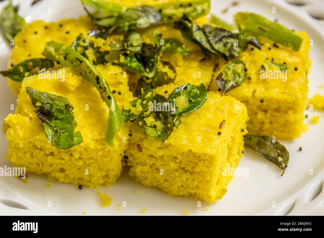 Dhokla famous dish in gujarat being served on the dinning table Stock ...