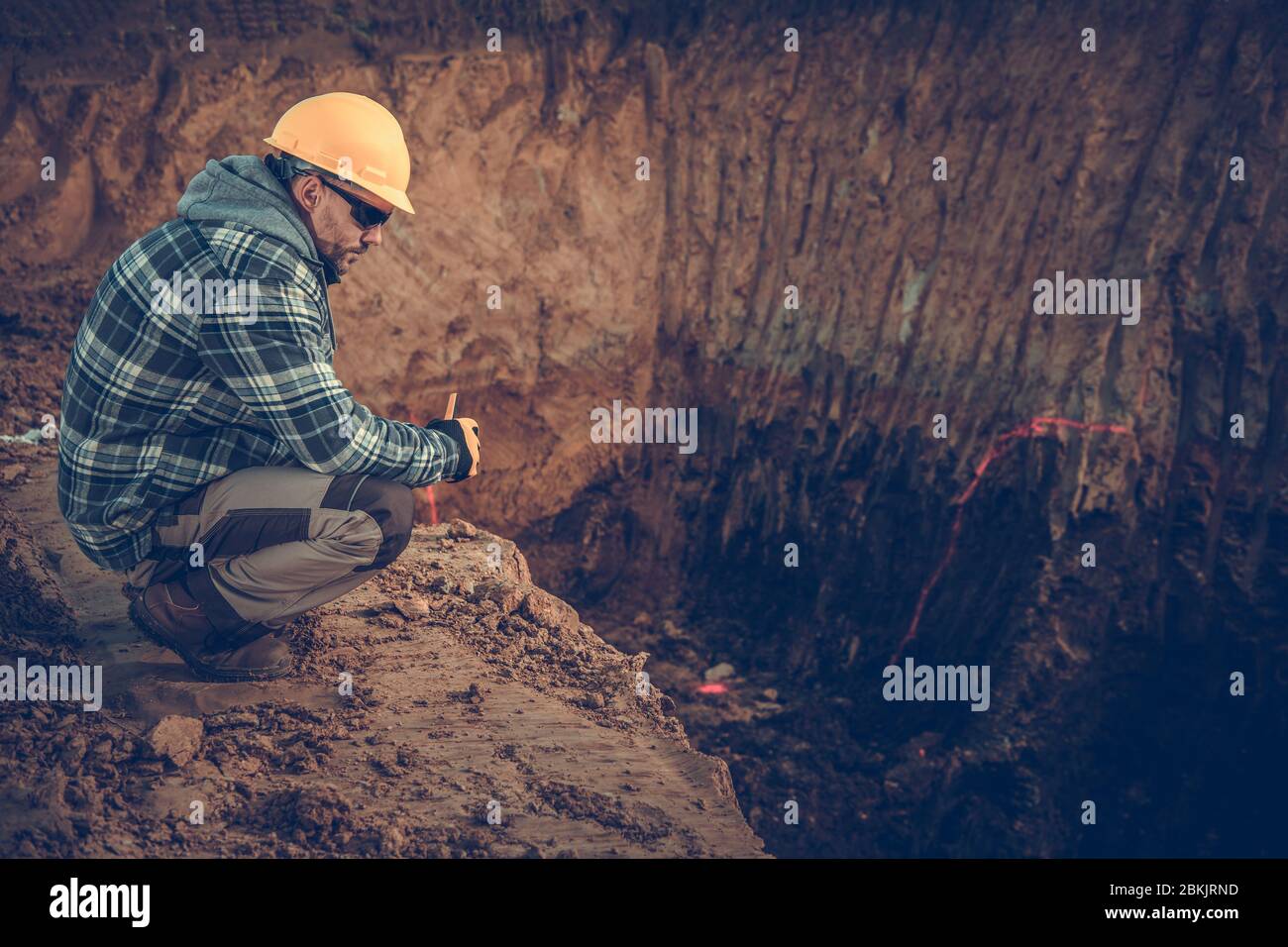 Male Engineering Geologist Analyzes Ground Materials For New ...