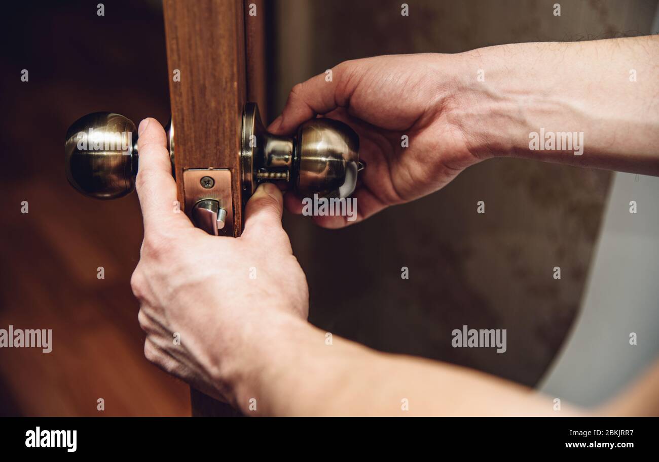 Person installing door handle hi-res stock photography and images - Alamy