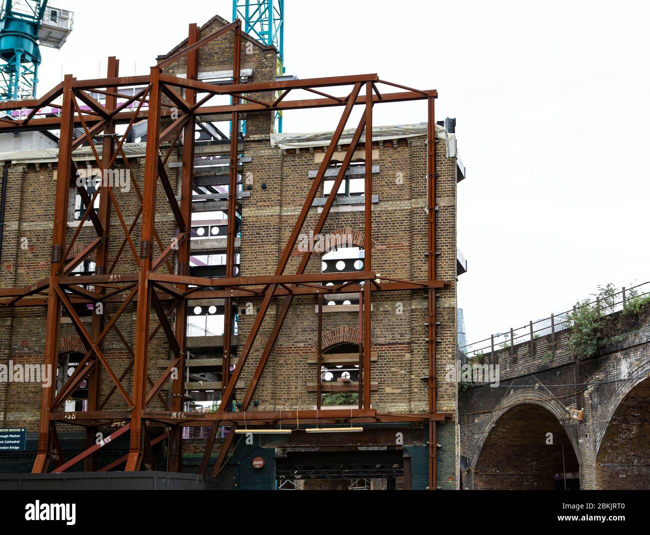 Hanging building facade with scaffolding Stock Photo - Alamy