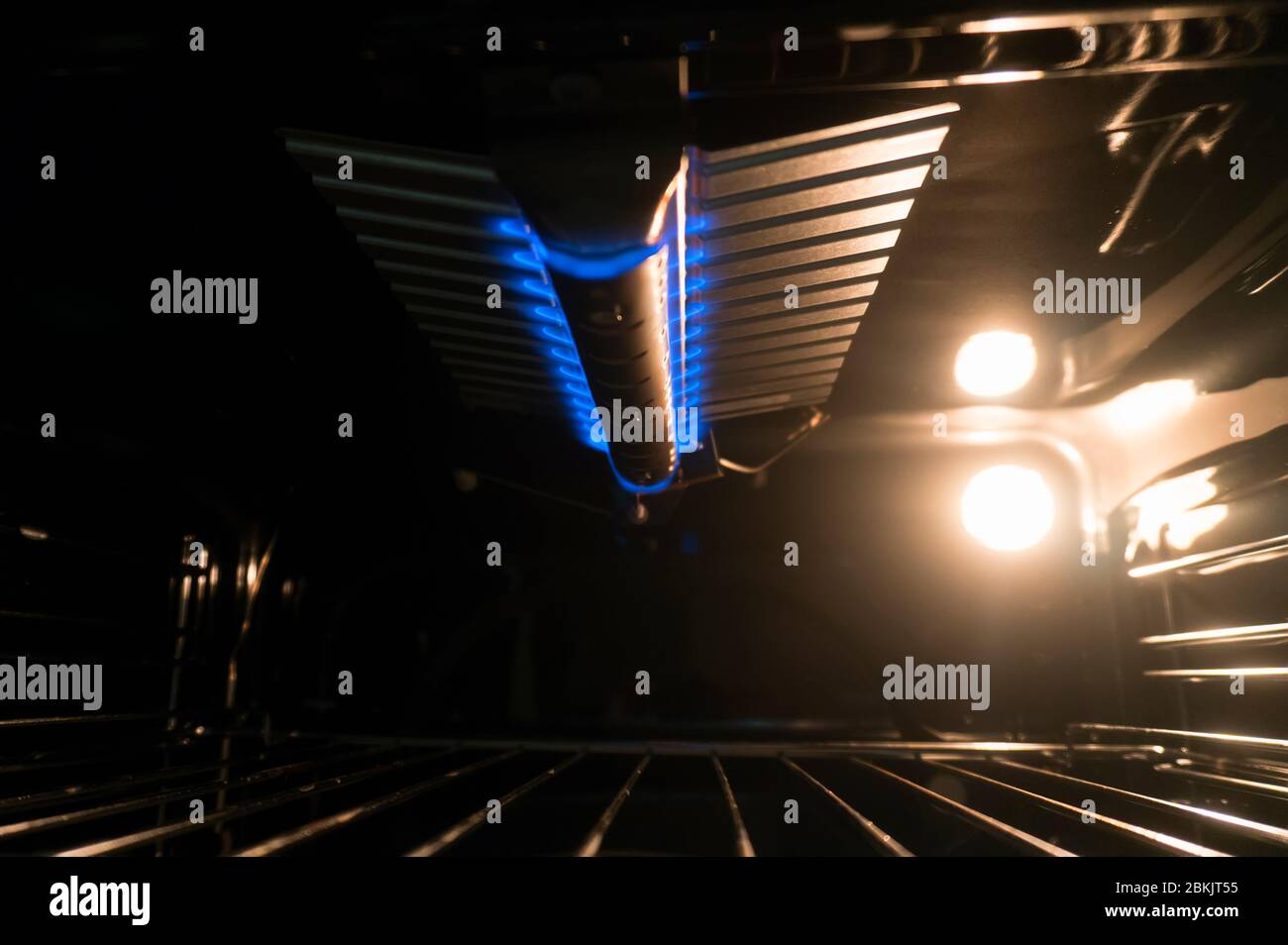 Oven gas flame inside, close up Stock Photo - Alamy