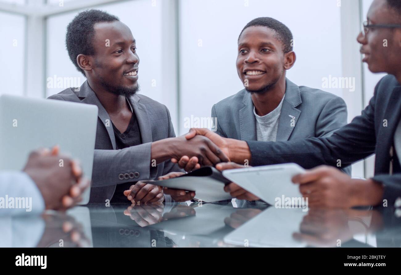 business partners greeting each other with a handshake Stock Photo - Alamy