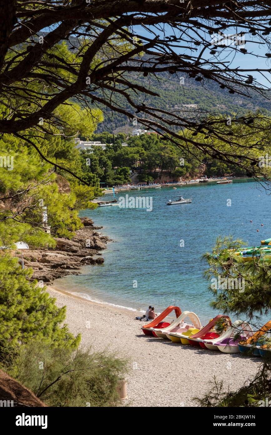 Bol beach on Brac island view with water cycles. With pebbles ...