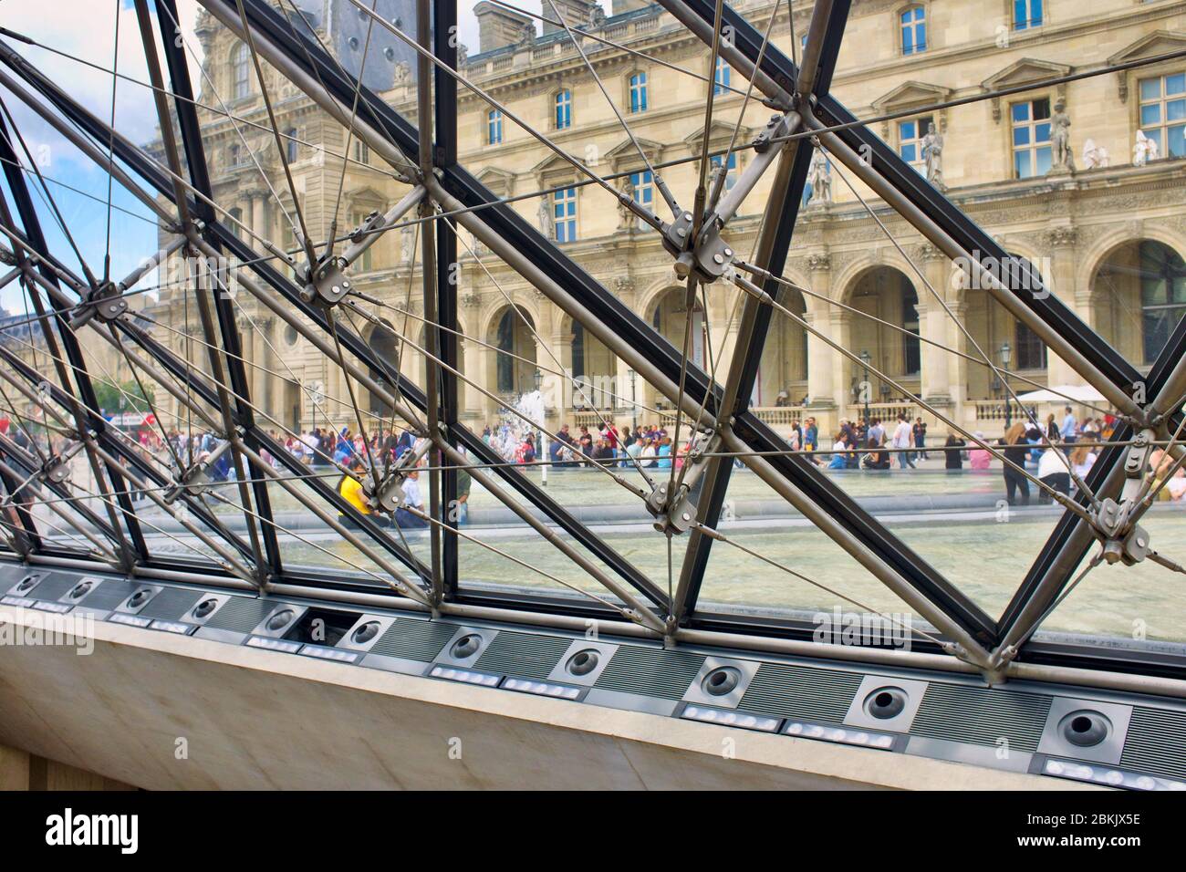 View from within the pyramid of the Louvre Palace by daylight in europe ...