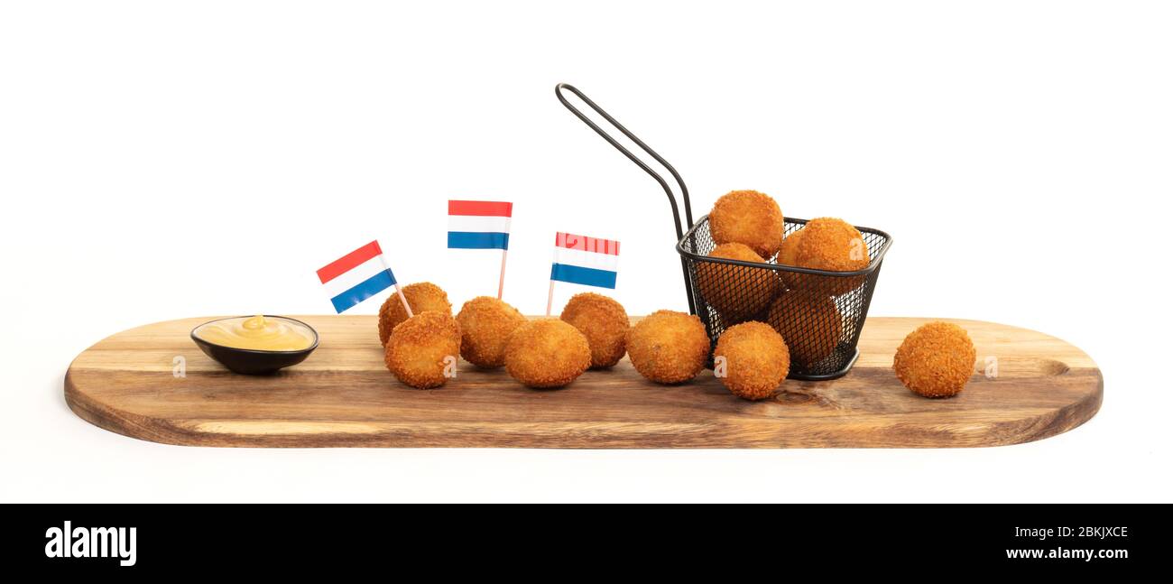 Dutch traditional snack bitterbal on a serving board, isolated Stock ...