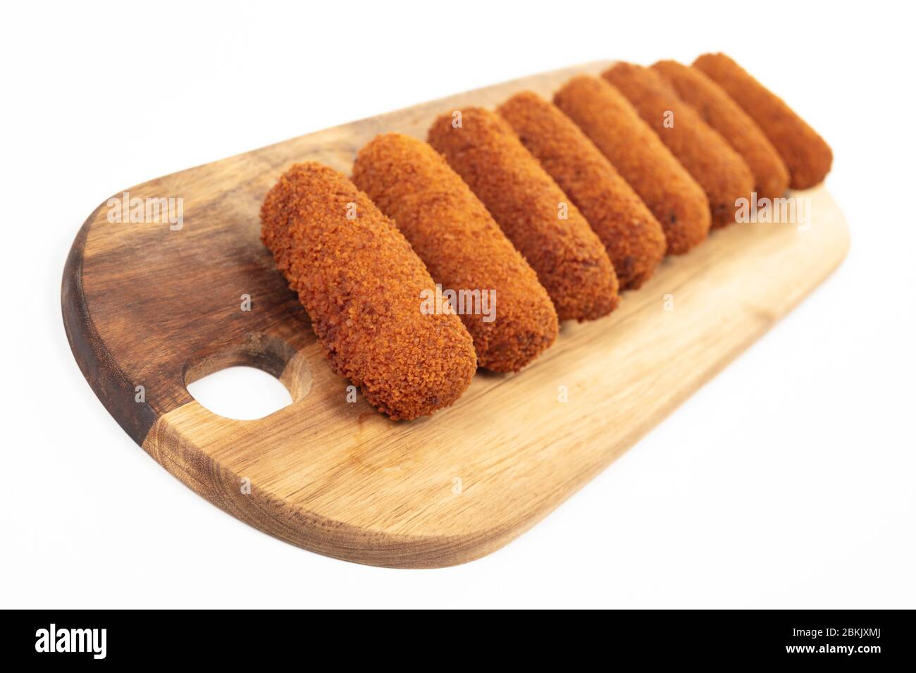 Brown crusty dutch kroketten on a serving tray, isolated on a white ...