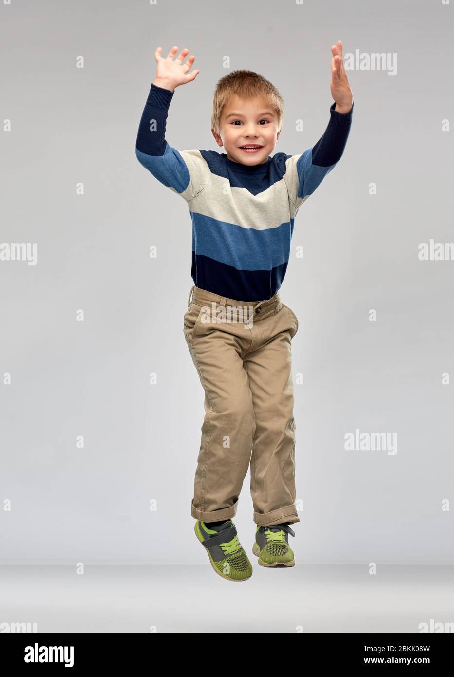 happy little boy jumping in air Stock Photo - Alamy