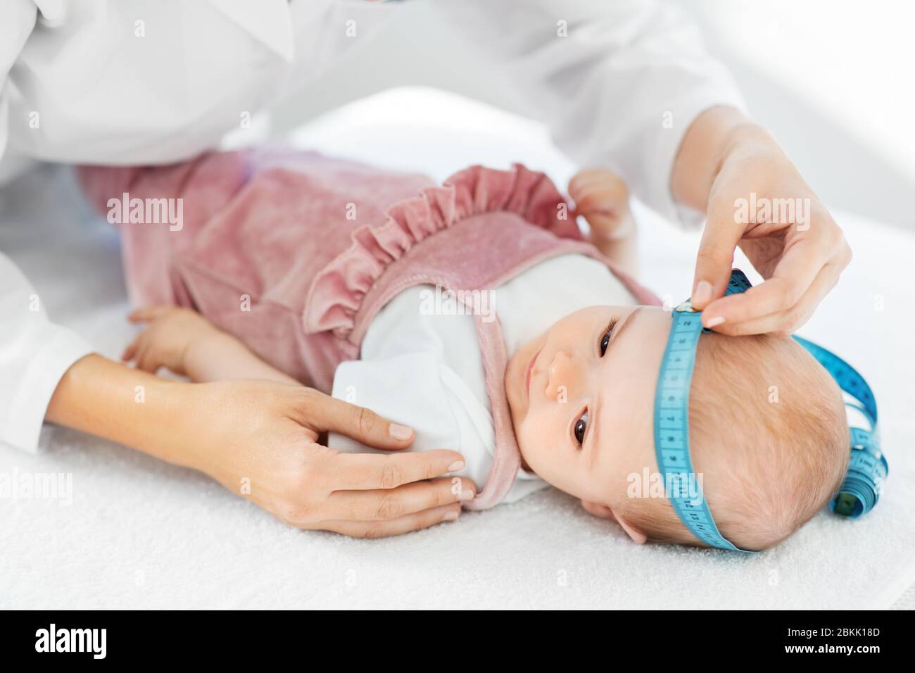Medical examination pediatrician girl measure hi-res stock photography ...