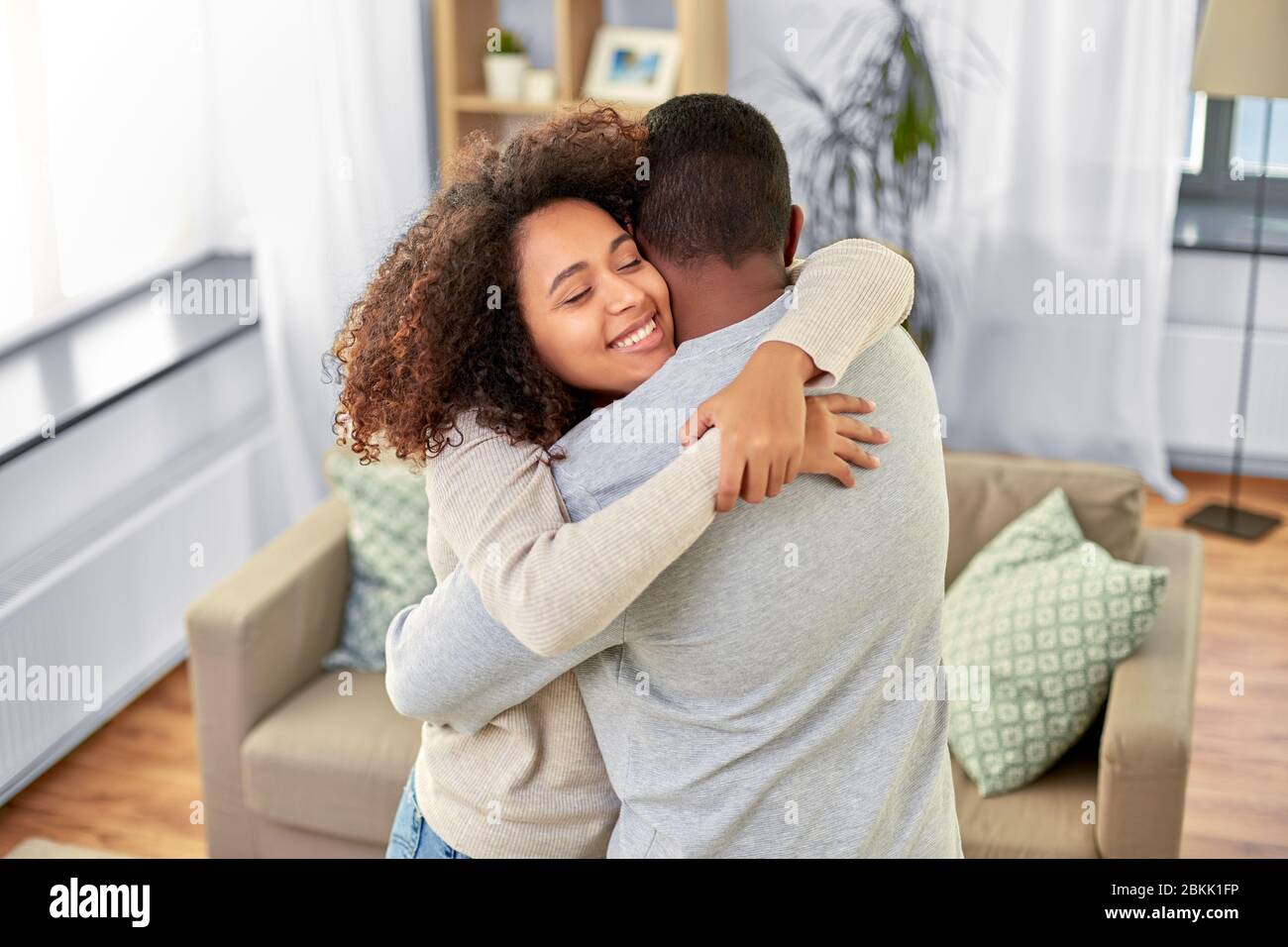 happy african american couple hugging at home Stock Photo - Alamy