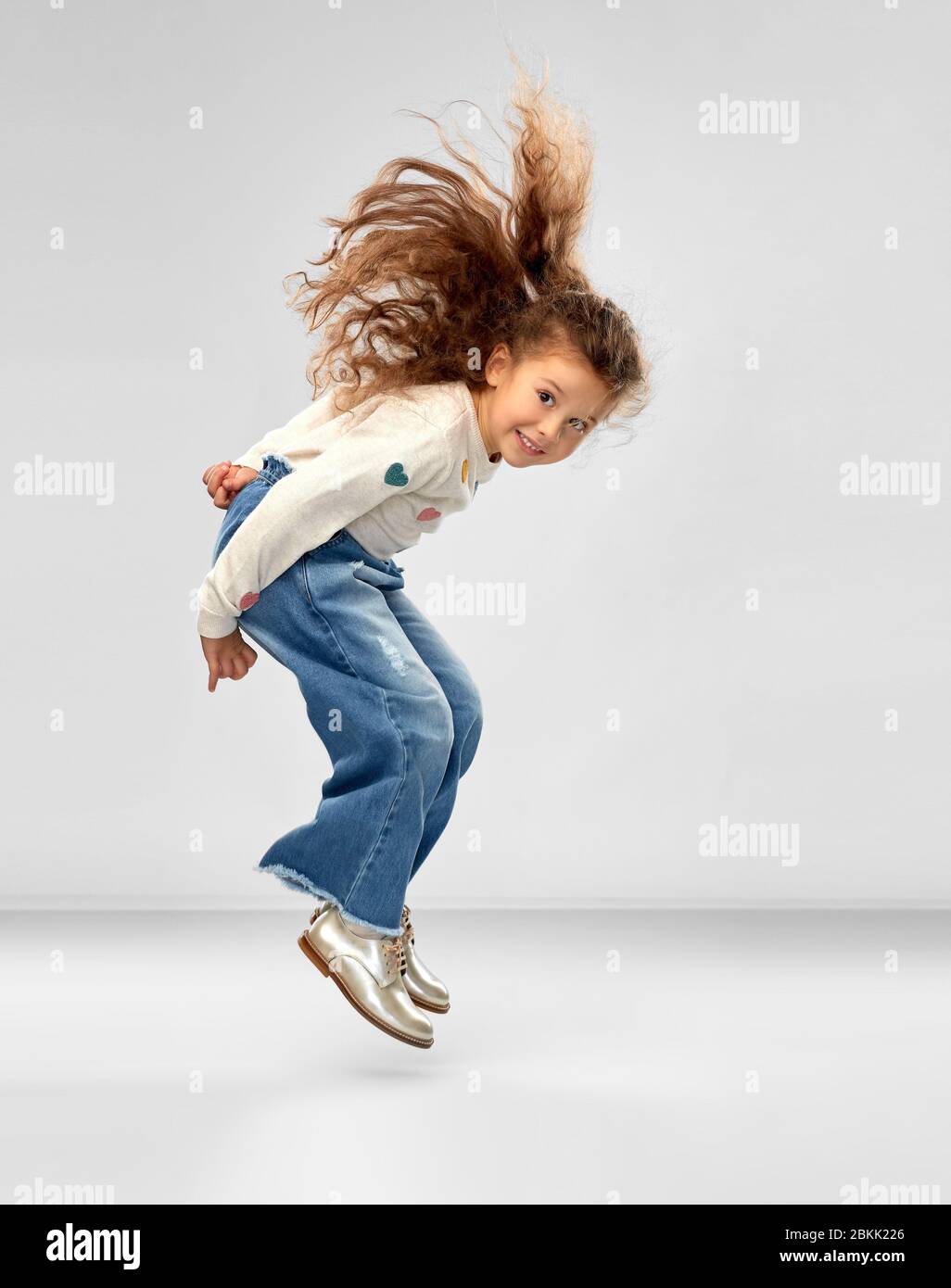 Kid jumping fashion hi-res stock photography and images - Alamy