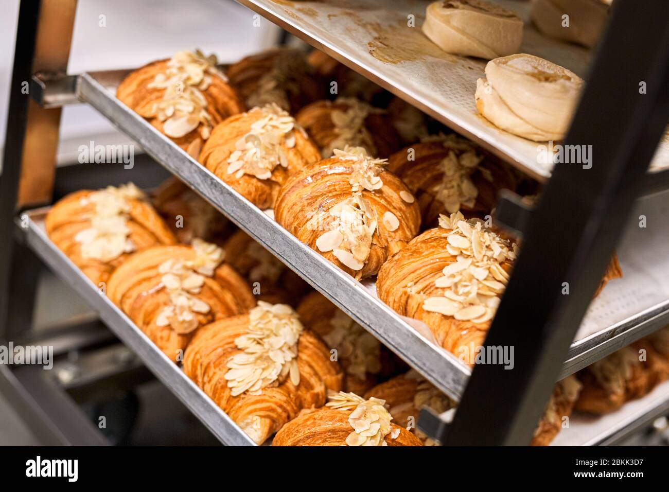 Shelves with loaves and pastry at kitchen in bakery Stock Photo - Alamy