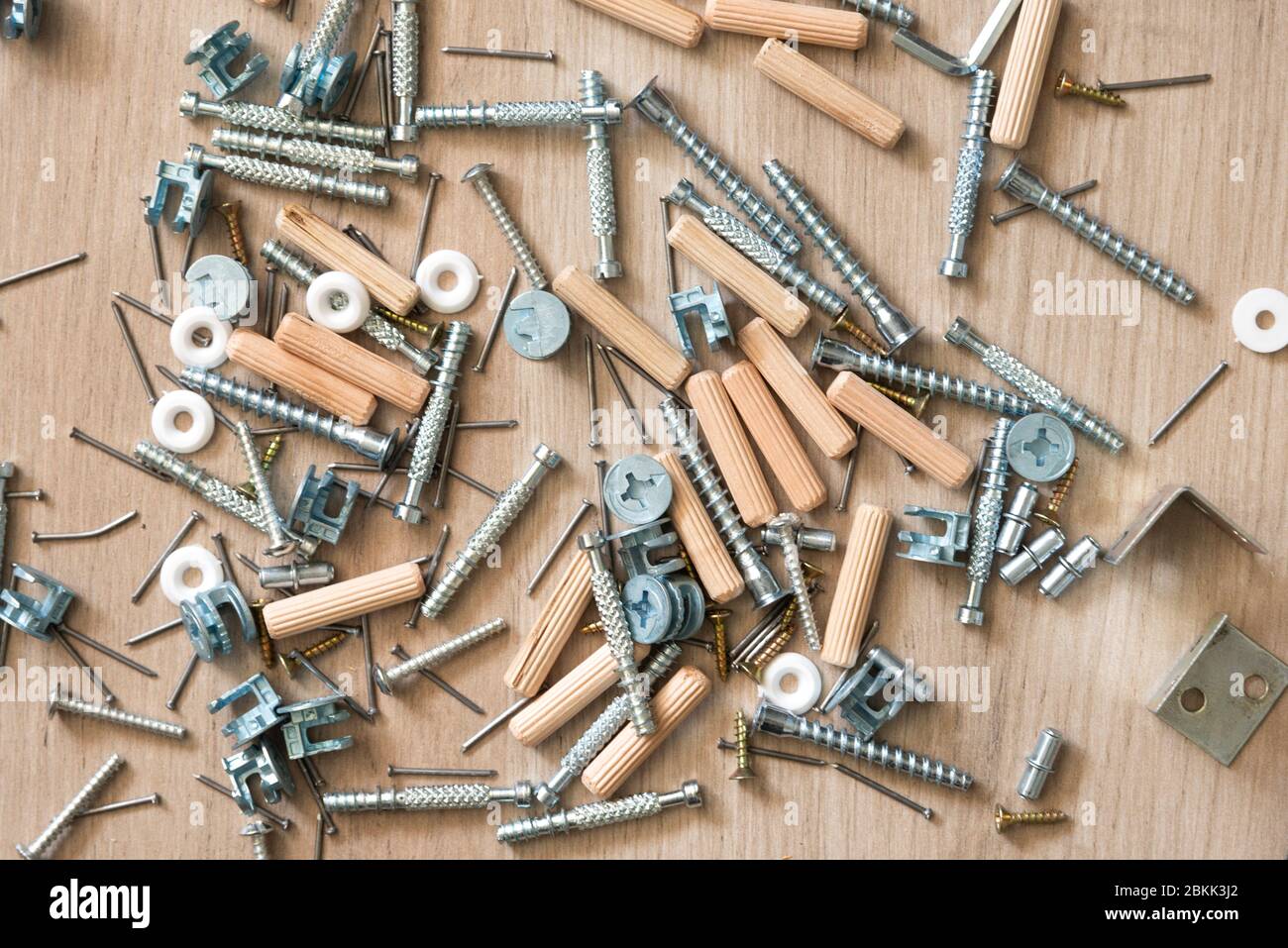 Assembly on top of a group of parts dowel, bolt, washer, screw for ...