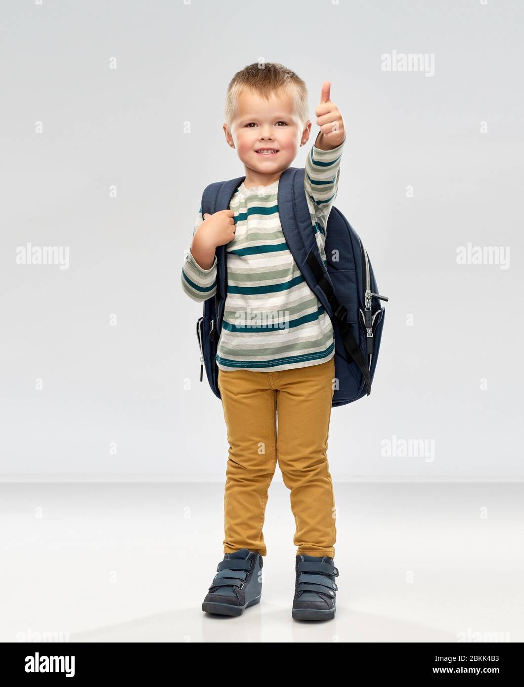 portrait of smiling boy with school backpack Stock Photo - Alamy