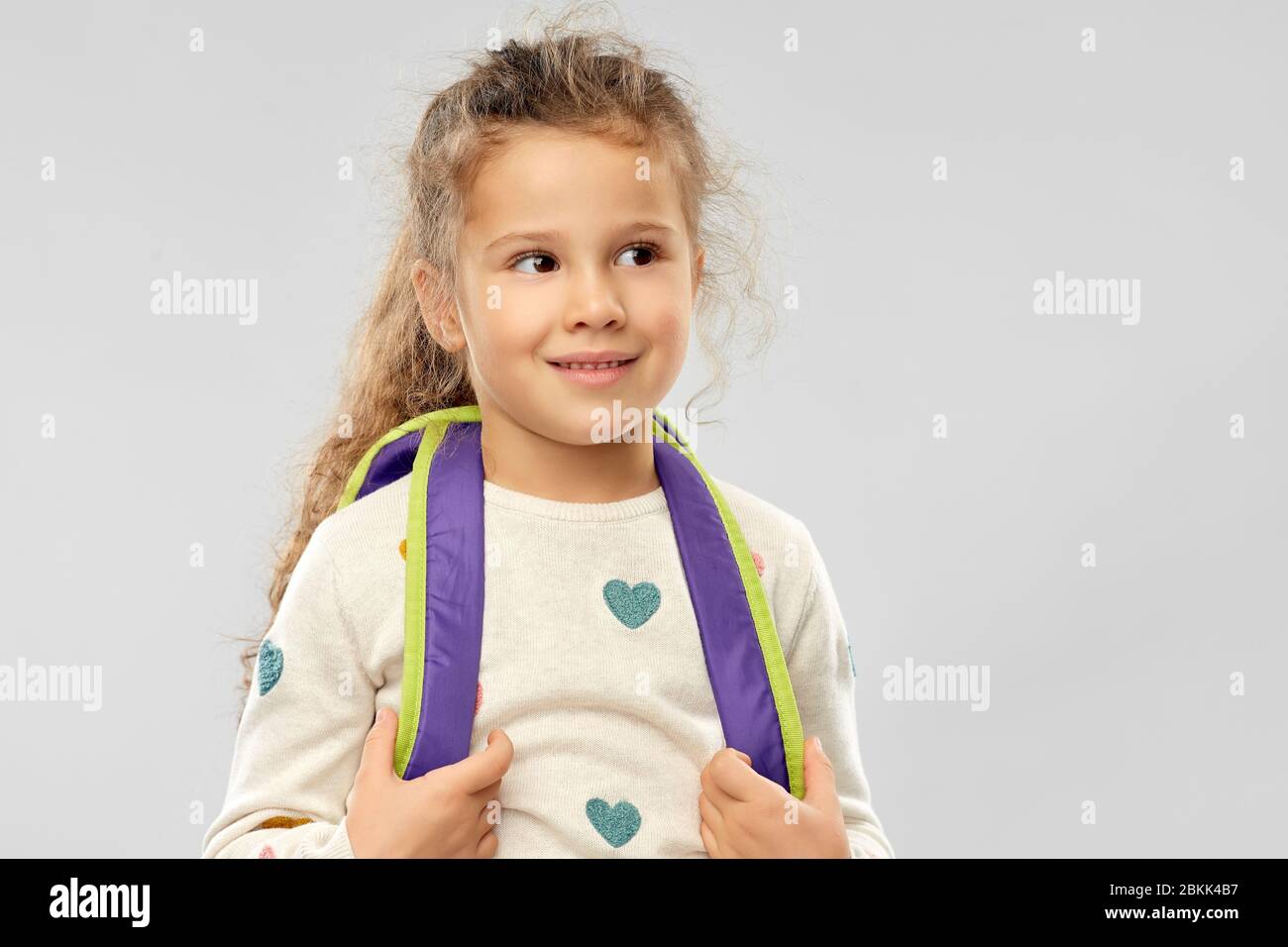 happy little girl with school backpack Stock Photo - Alamy