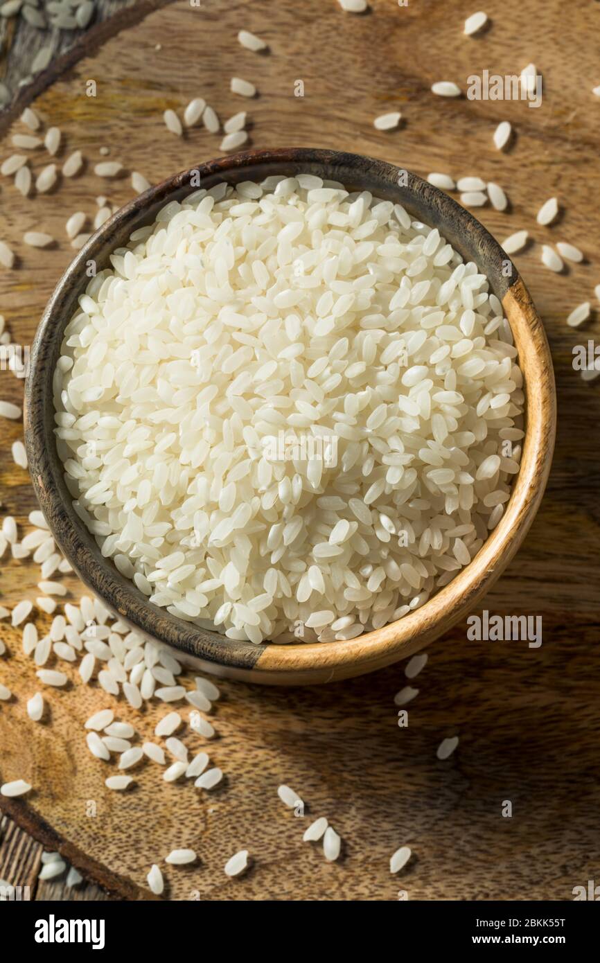 Raw Organic Dry White Rice in a Bowl Stock Photo - Alamy
